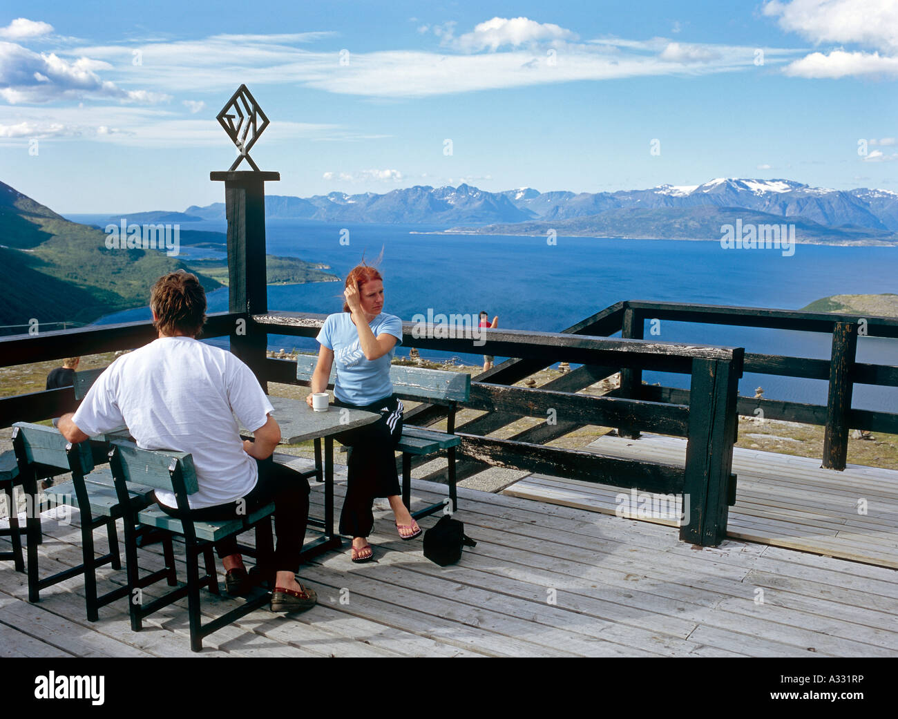 Tourists sitting on an observation platform, Gildetun, Norway Stock ...