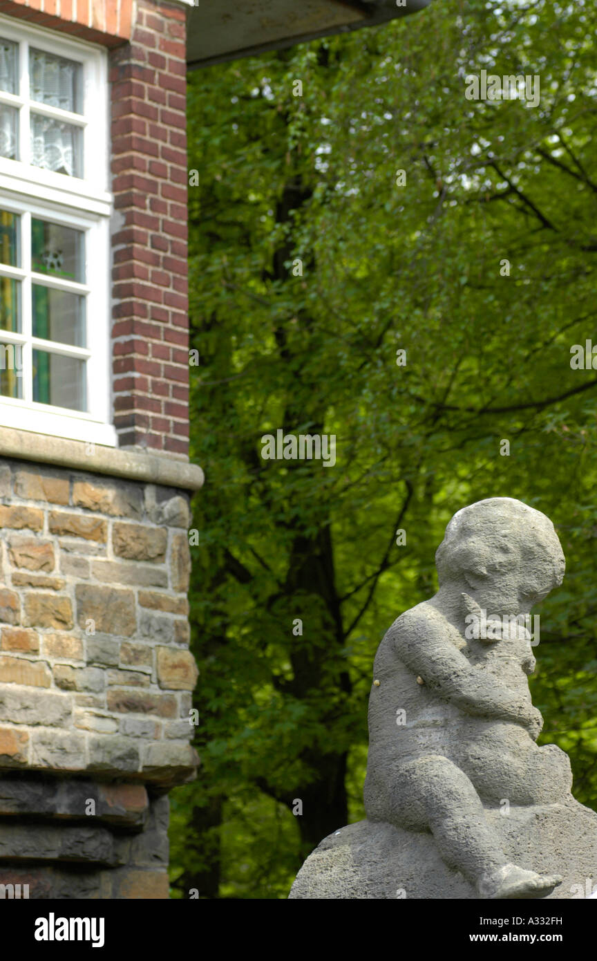 bay oriel with window with a garden garden skulptur in housing estate ...