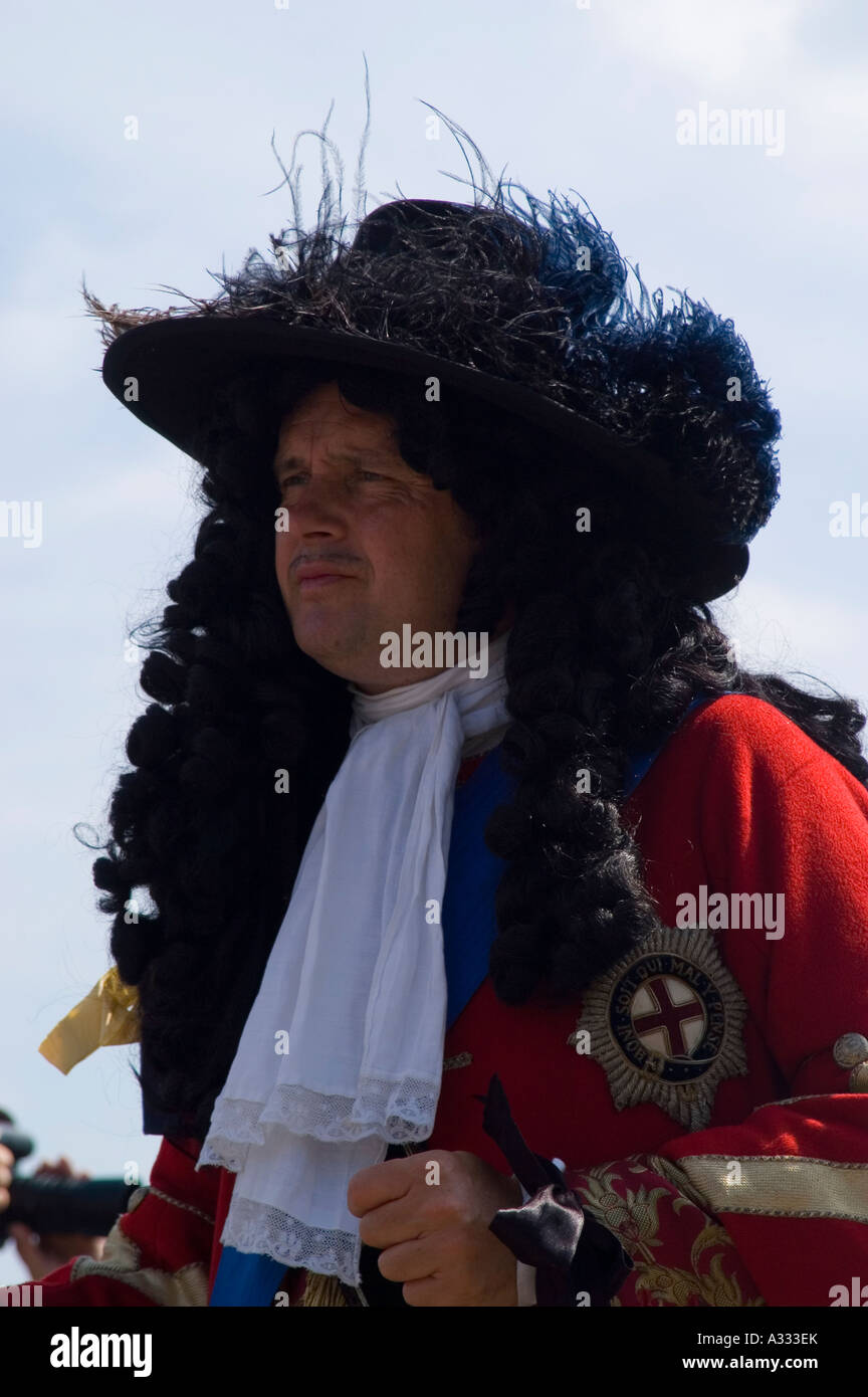 An actor playing King Charles the second at a Restoration period garden ...