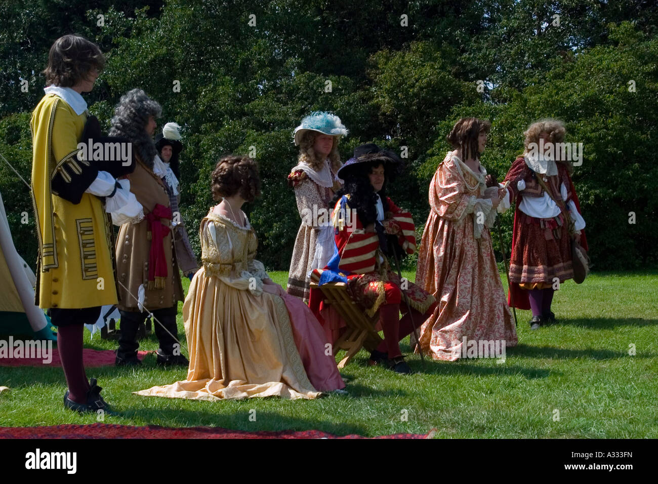 Actors playing King Charles and his entourage at a Restoration period ...