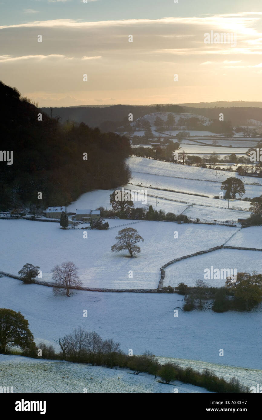 Early winter snow on the Cotswold escarpment below Coaley Wood towards ...