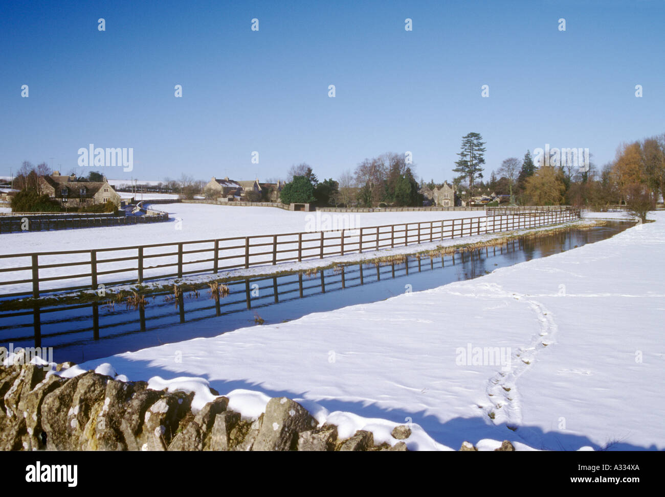 The River Coln at the Cotswold village of Coln Rogers, Gloucestershire ...