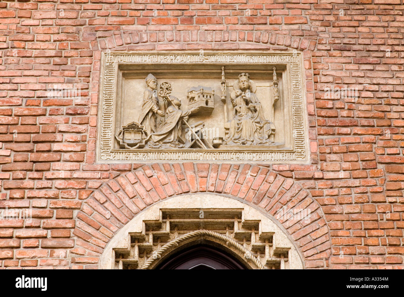 Religious motif carving inset within the quadrangle wall of the ...