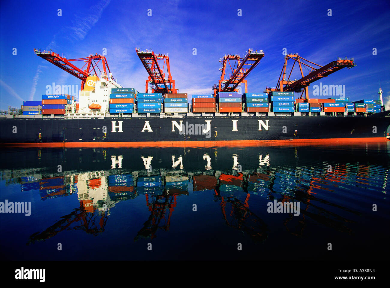 Loaded Container Ship in Port with Reflection Stock Photo - Alamy