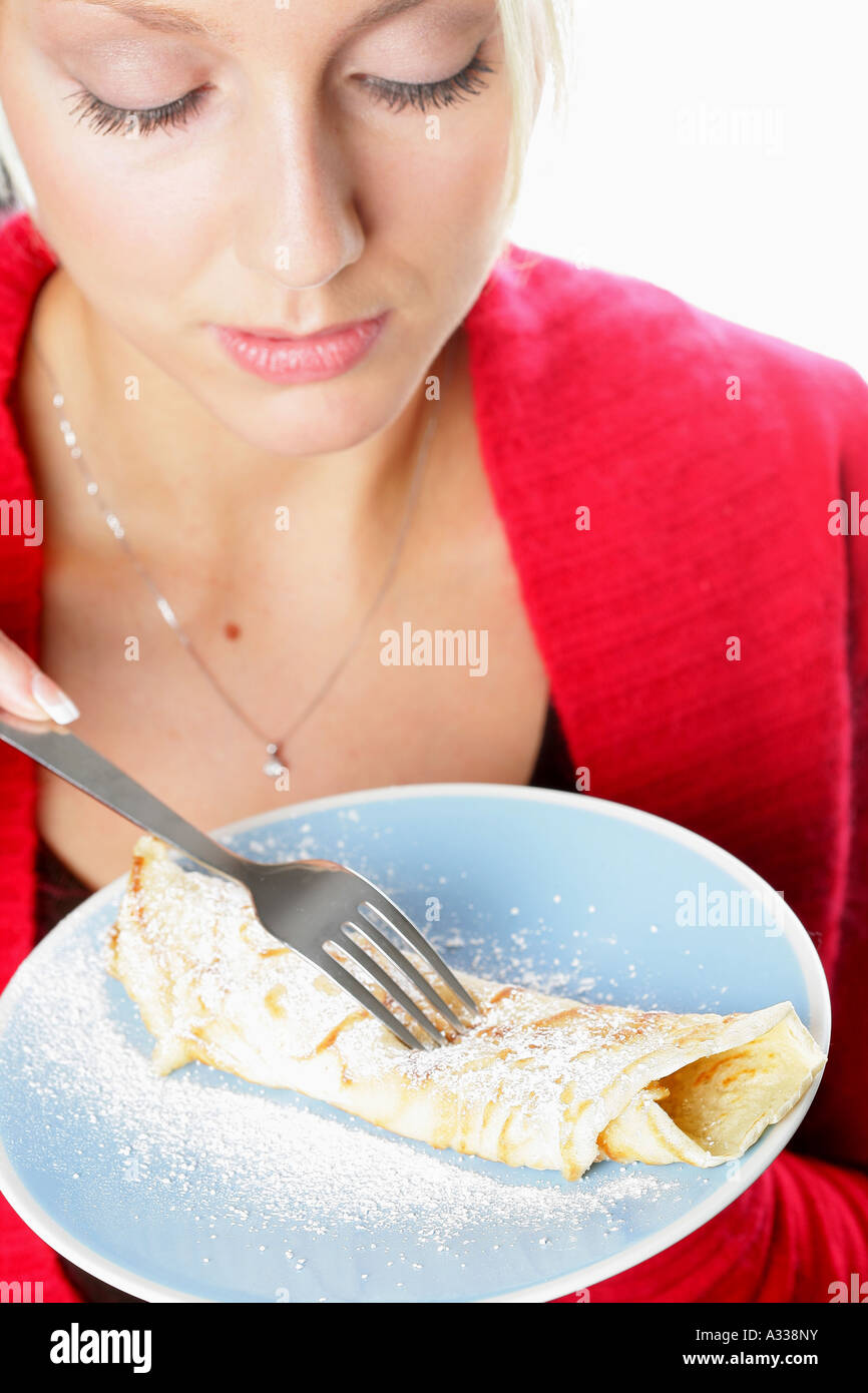 Young Woman Eating a Pancake Model Released Stock Photo - Alamy