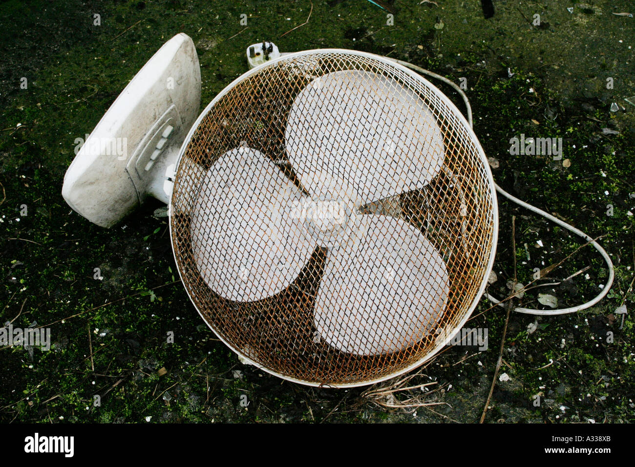 old fan discarded Stock Photo - Alamy