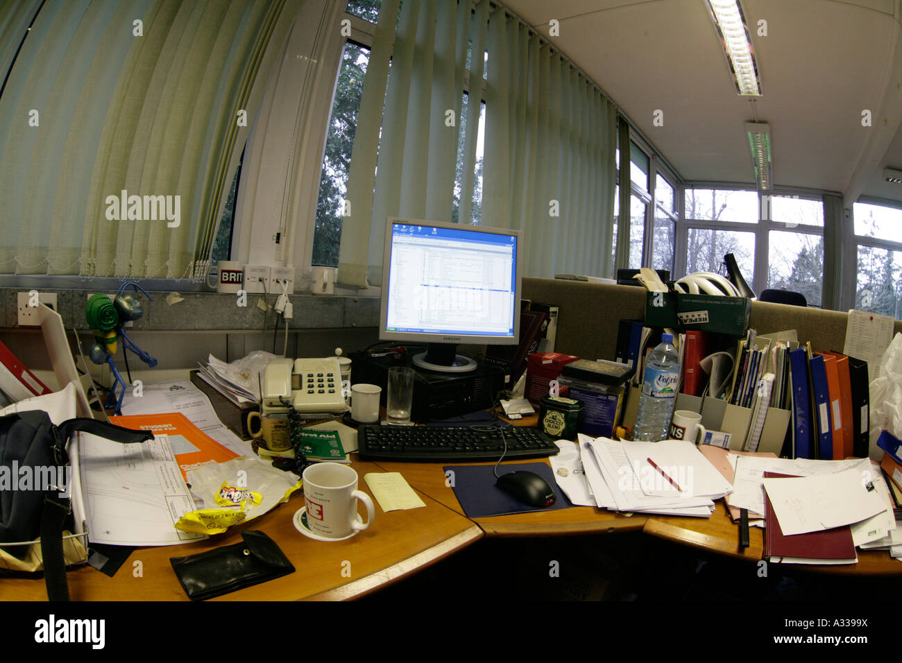 Desk computer workstation cubicle fish eye distorted view clutter ...