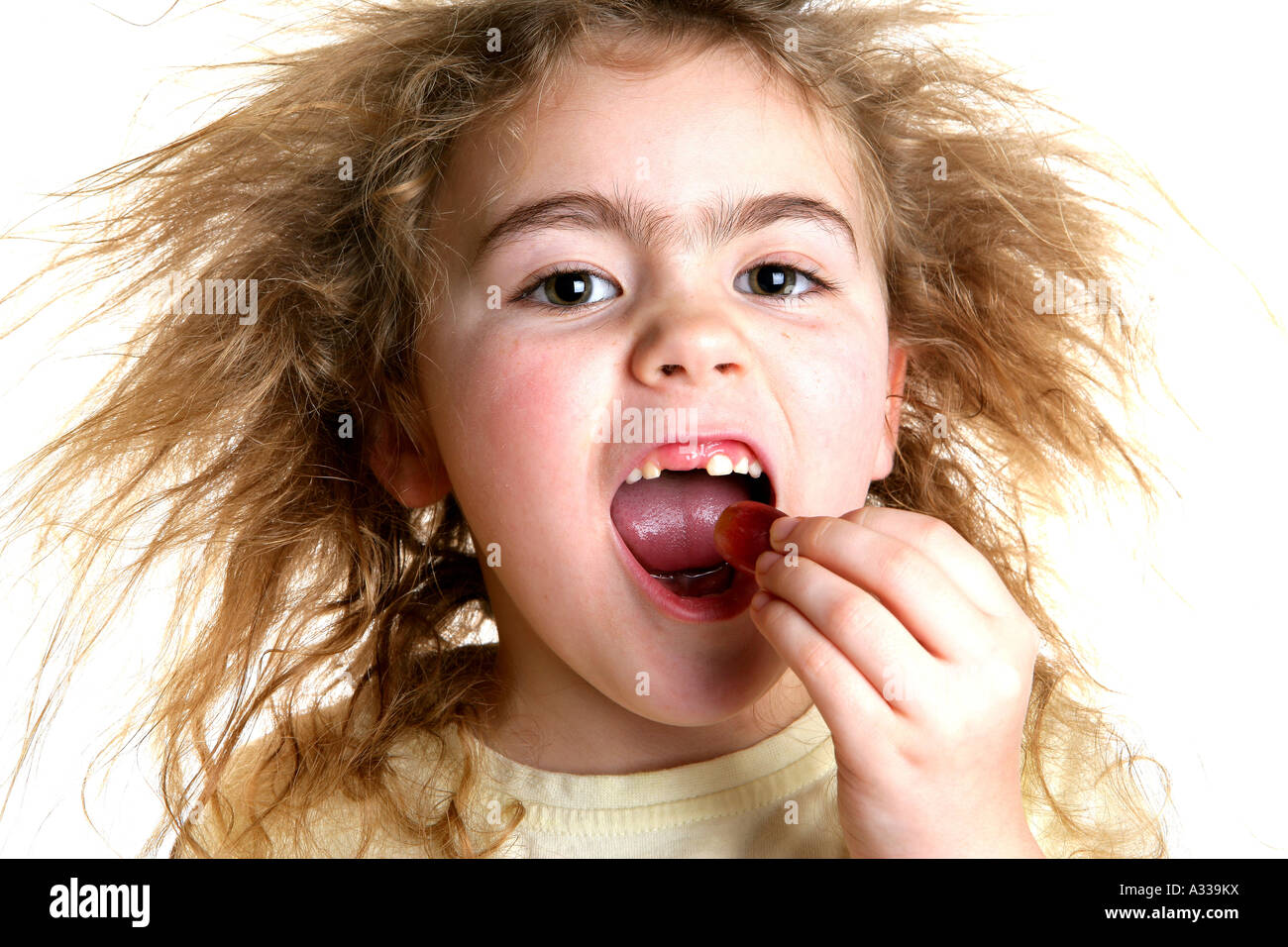 Young Girl Eating a Red Grape Model Released Stock Photo - Alamy