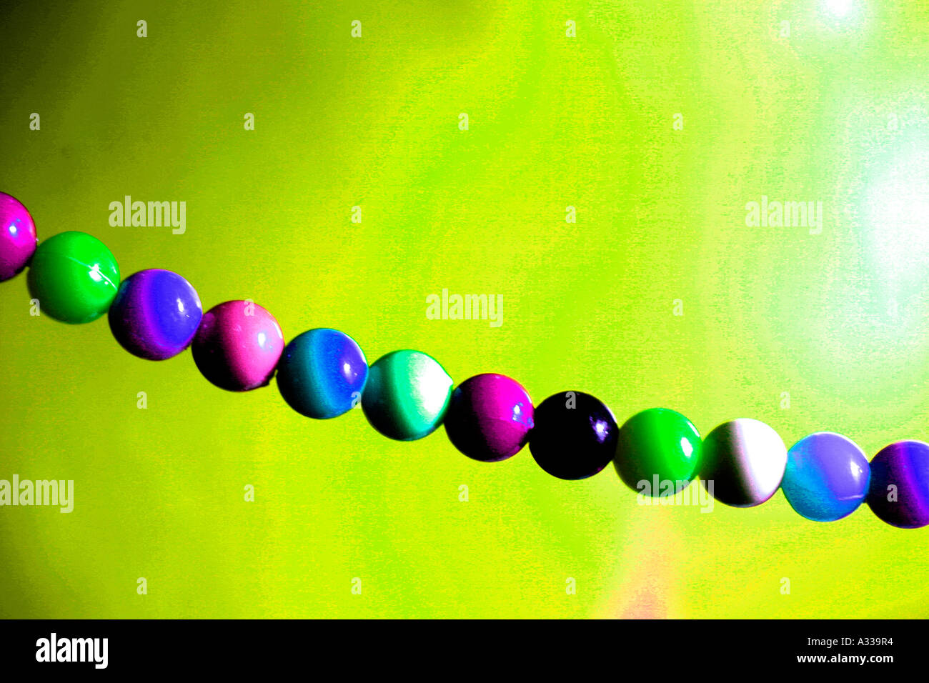coloured beads on string Stock Photo - Alamy