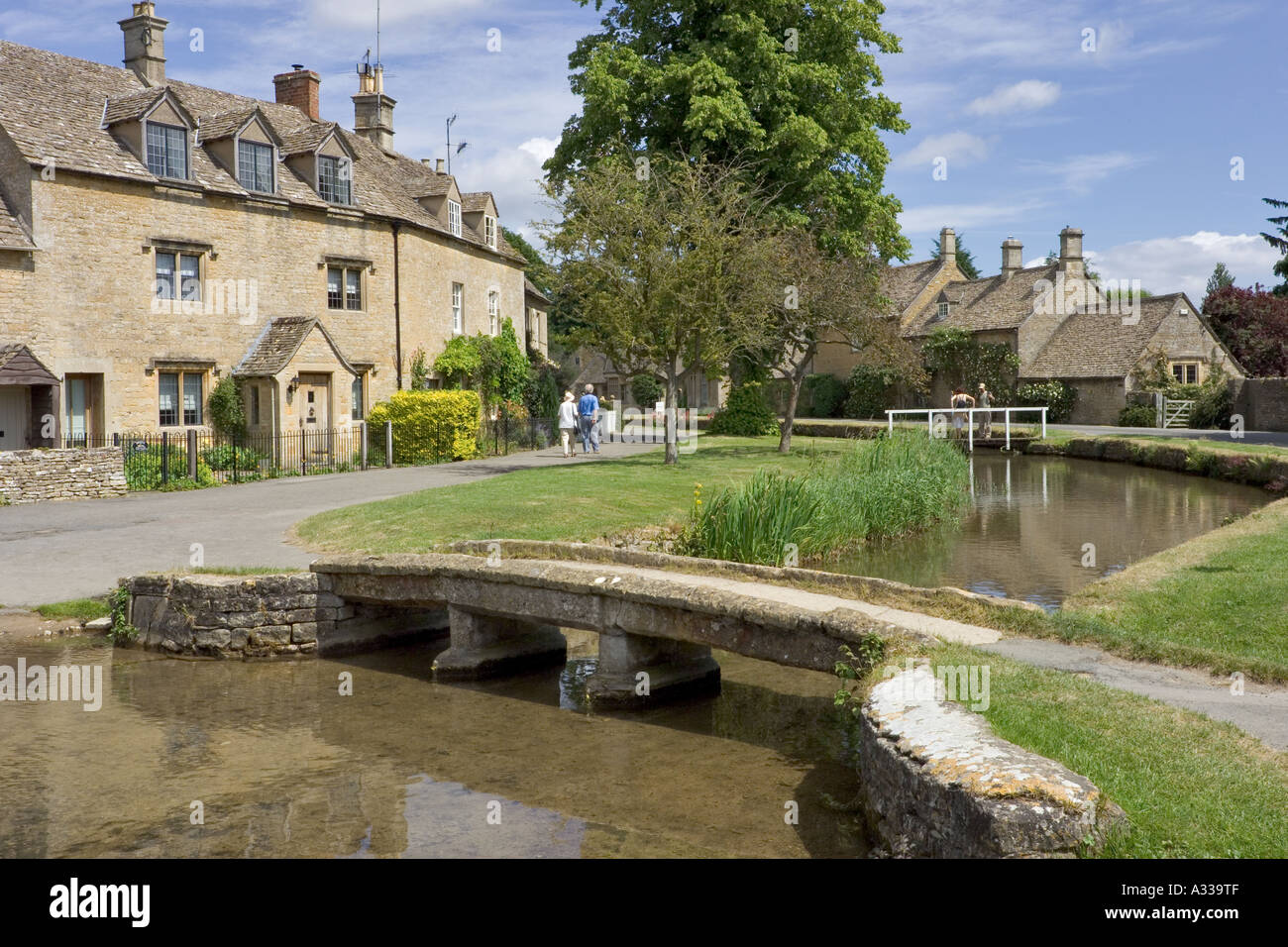 Bridge over the River Eye in the Cotswold village of Lower Slaughter ...