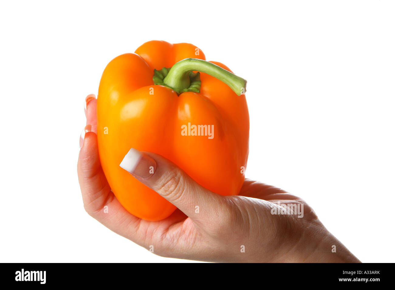 Woman Holding an Orange Pepper Model Released Stock Photo - Alamy