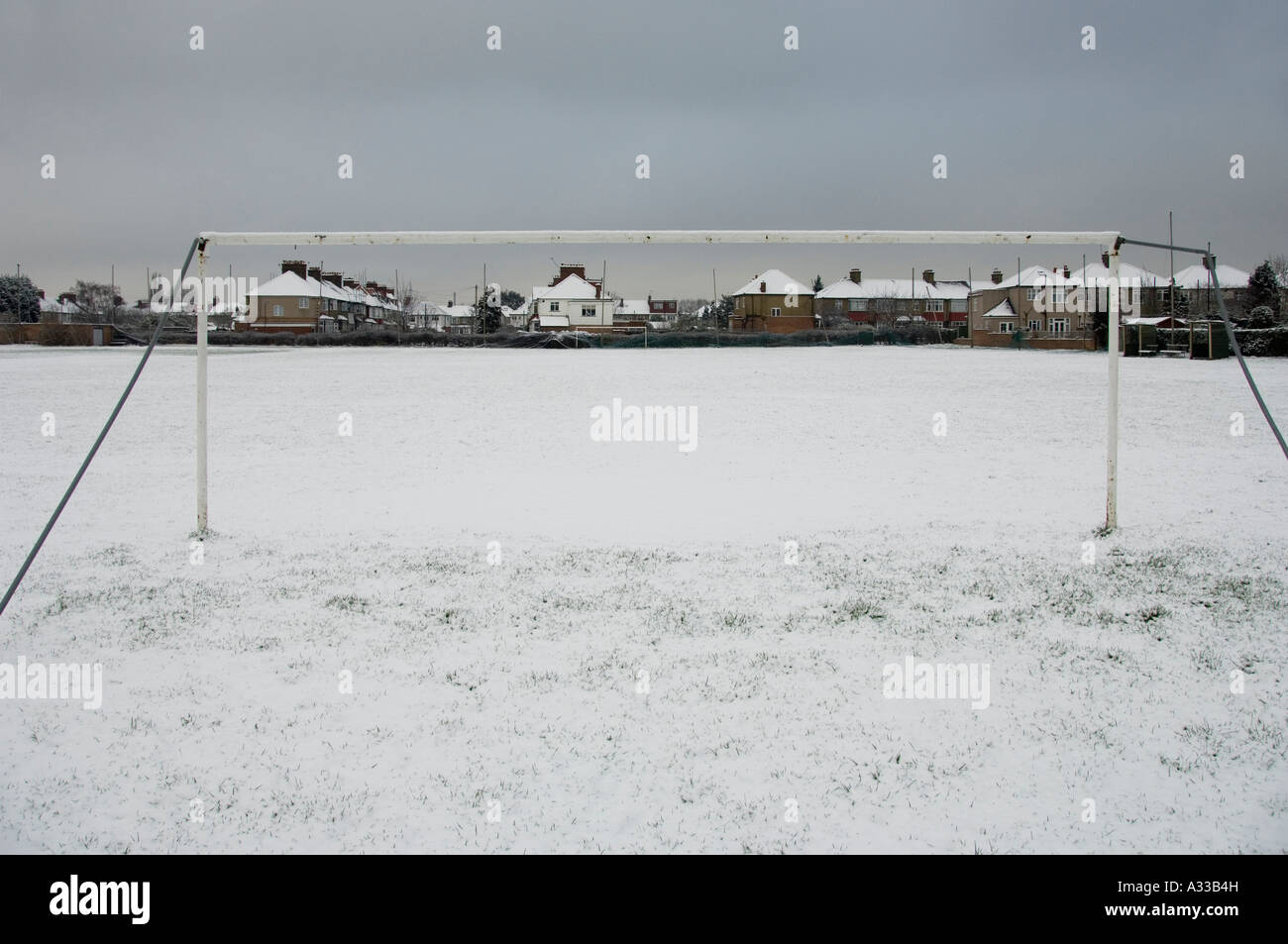 Frozen snow covered football pitch Stock Photo - Alamy