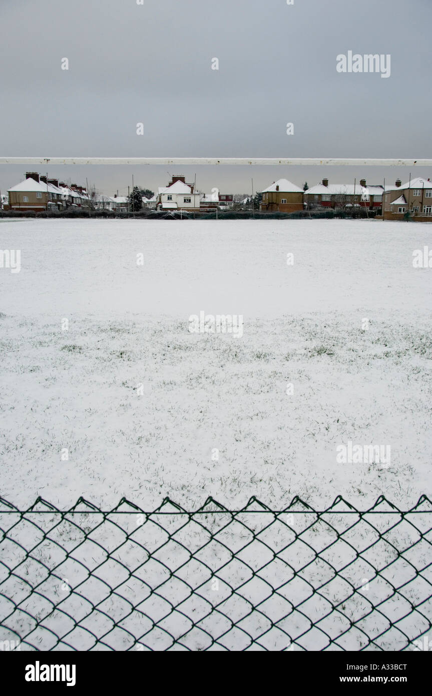 Frozen football pitch and goal post in snow Stock Photo - Alamy