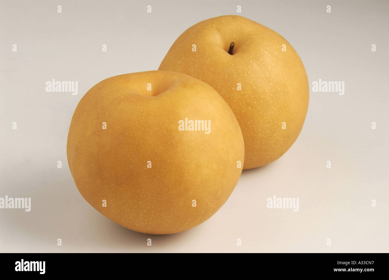 Two Korean pears on a surface Stock Photo - Alamy