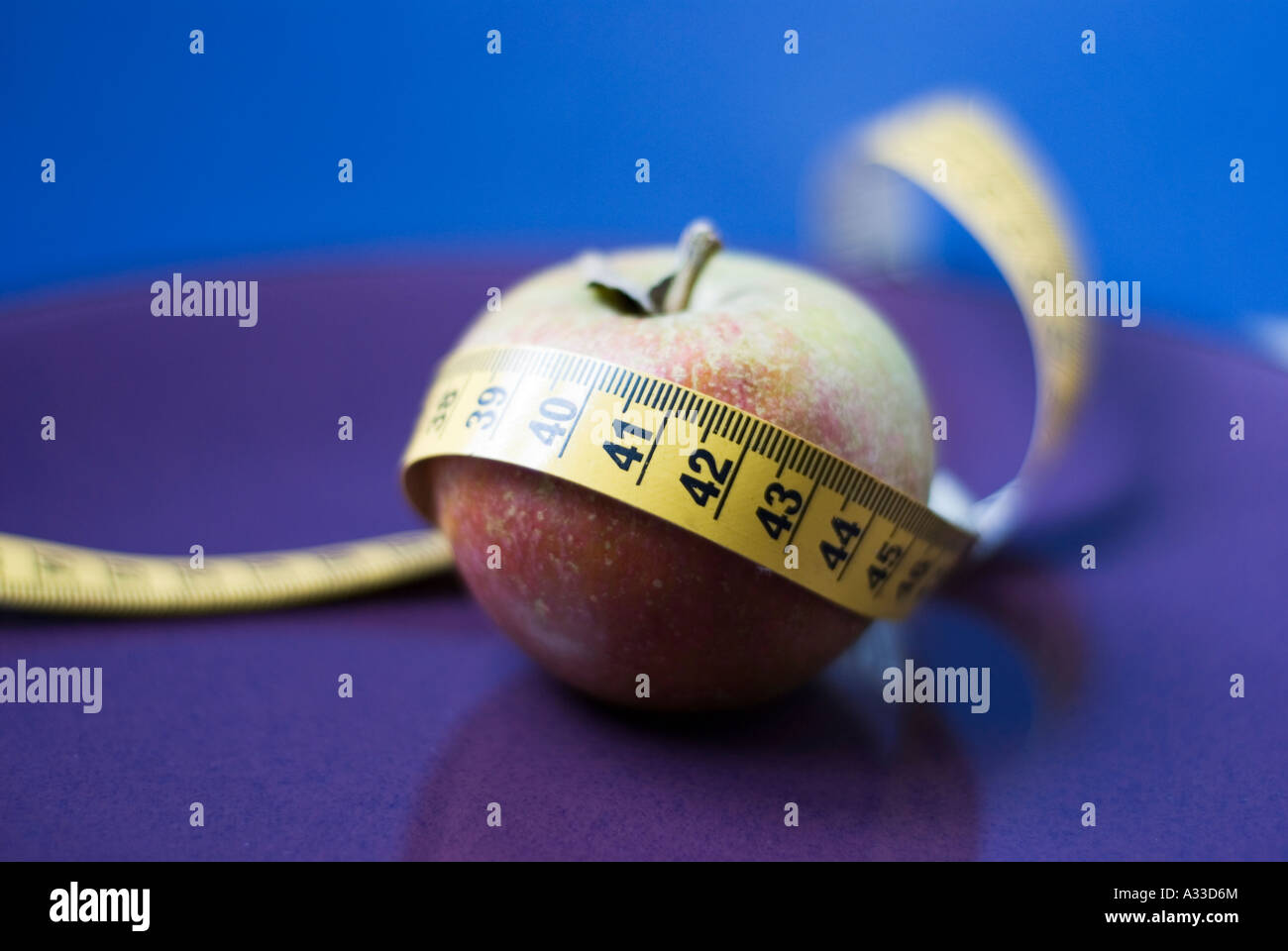 Apple with tape measure Stock Photo - Alamy