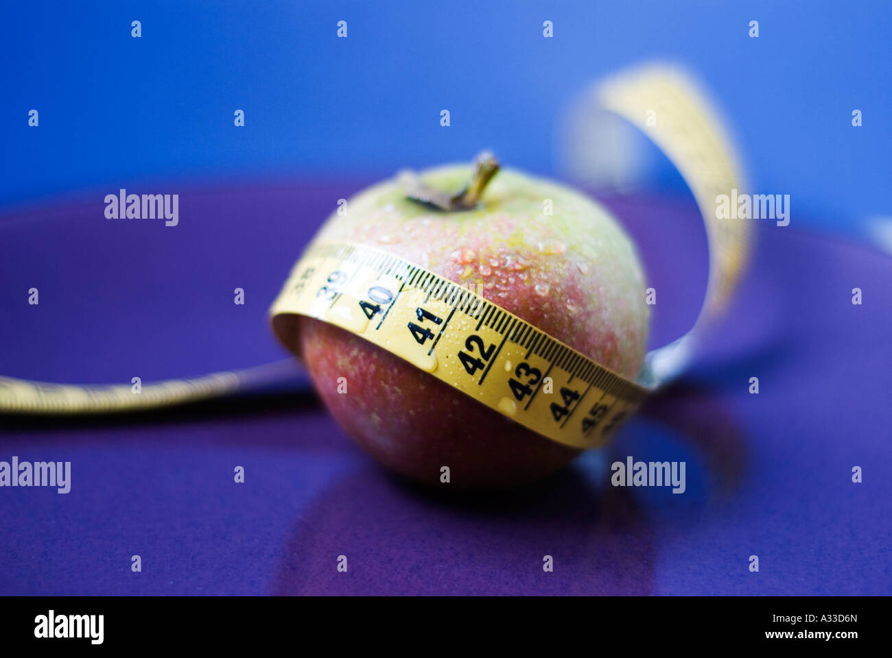 Apple with tape measure Stock Photo - Alamy