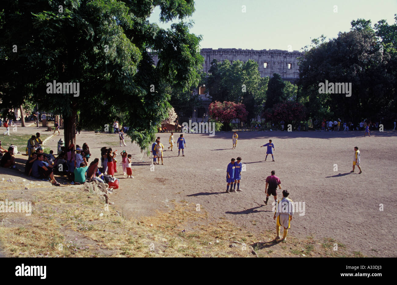 Italians playing Football with the Colosseum beyond, Rome, Italy Stock ...