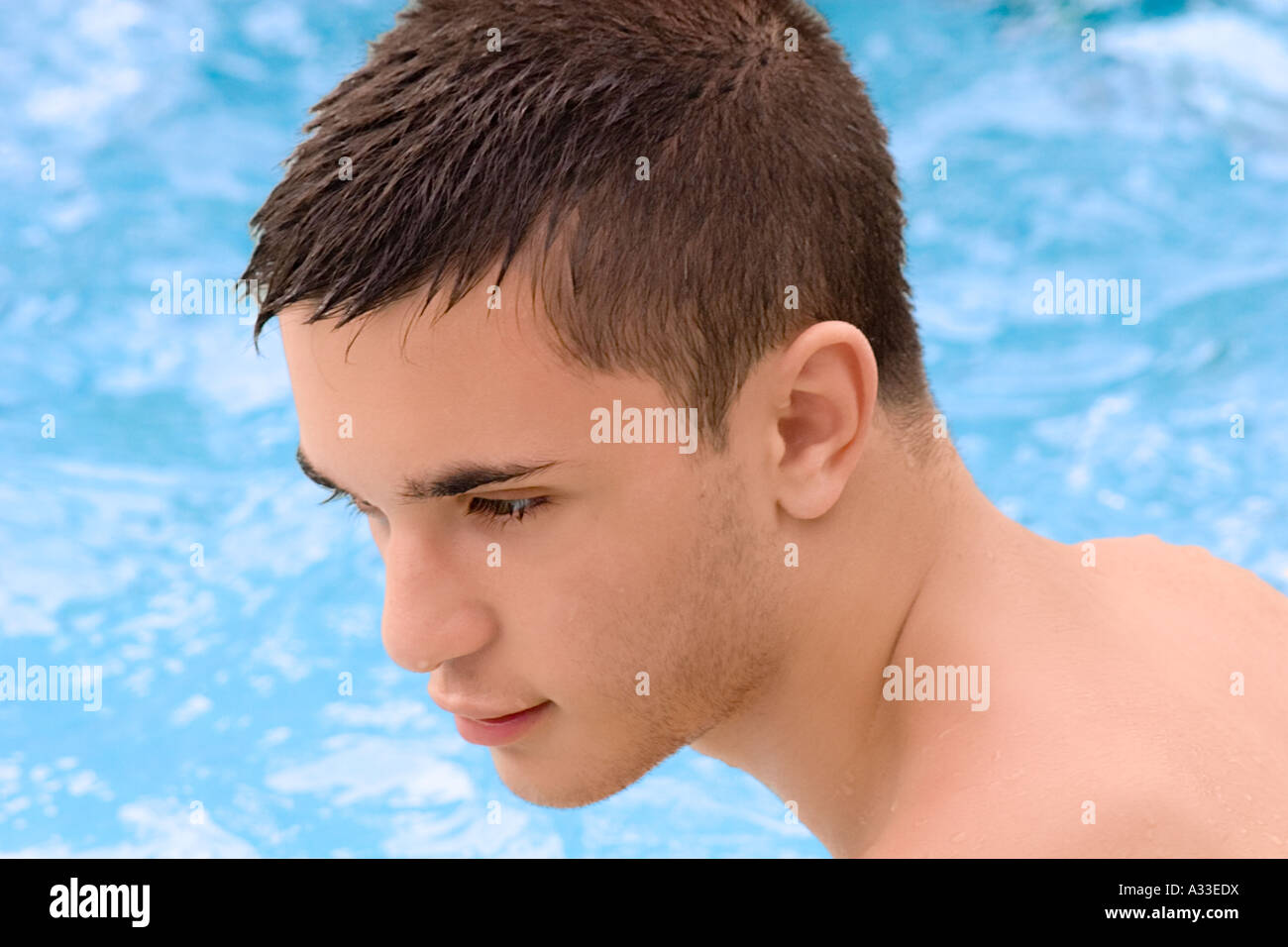 A side view portrait of young man in a swimming pool Stock Photo - Alamy