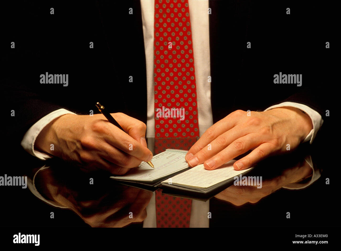 Writing a check MR147 Stock Photo - Alamy