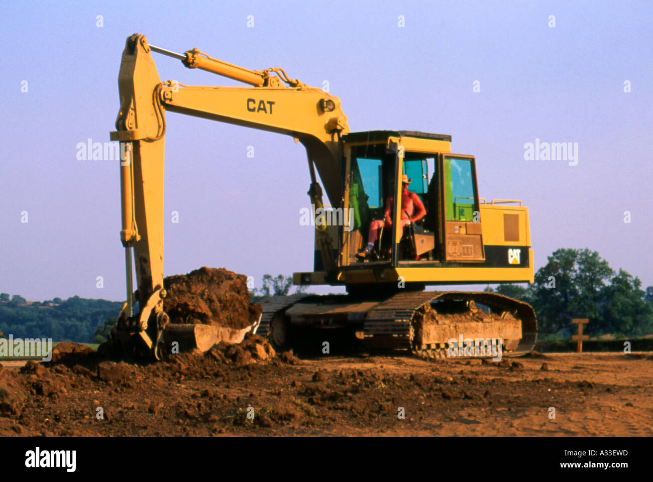 Cat Excavator at work Stock Photo - Alamy