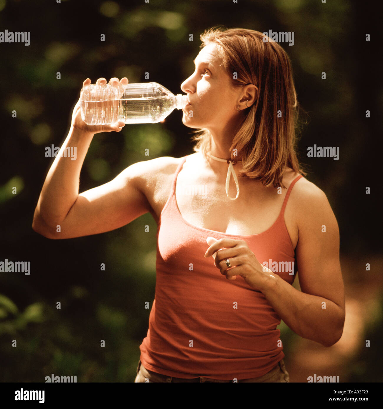 woman drinking from water bottle outdoors Stock Photo - Alamy