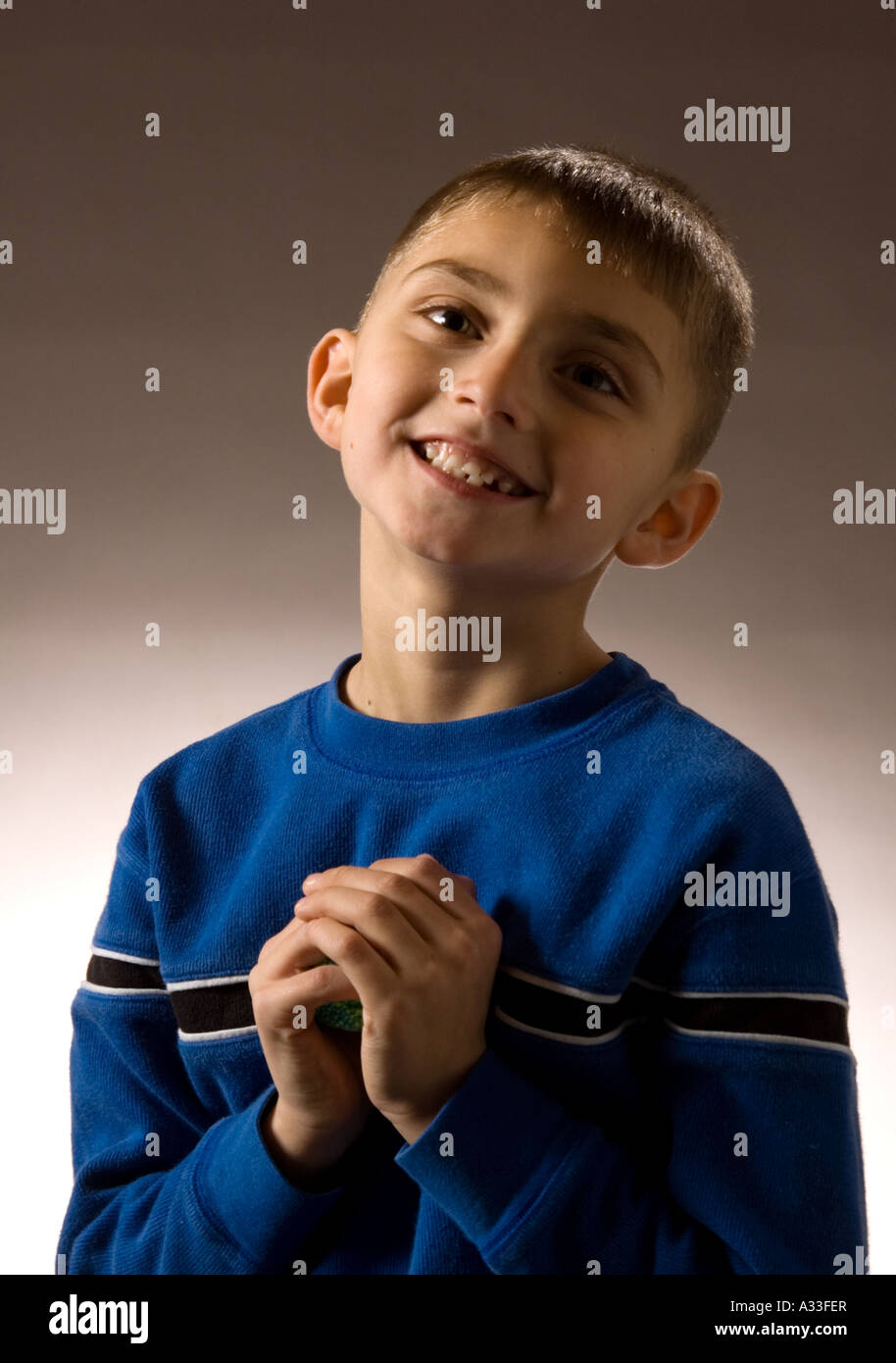 Formal portrait setting with 6 year old child making faces for the ...