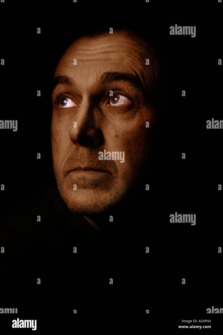 Photoshop enhanced portrait of an old man looking fearfully upward ...