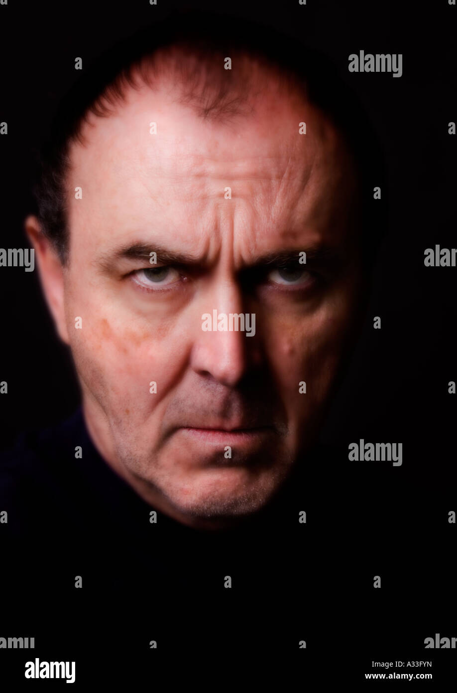 Angry old man stares at the camera Stock Photo - Alamy