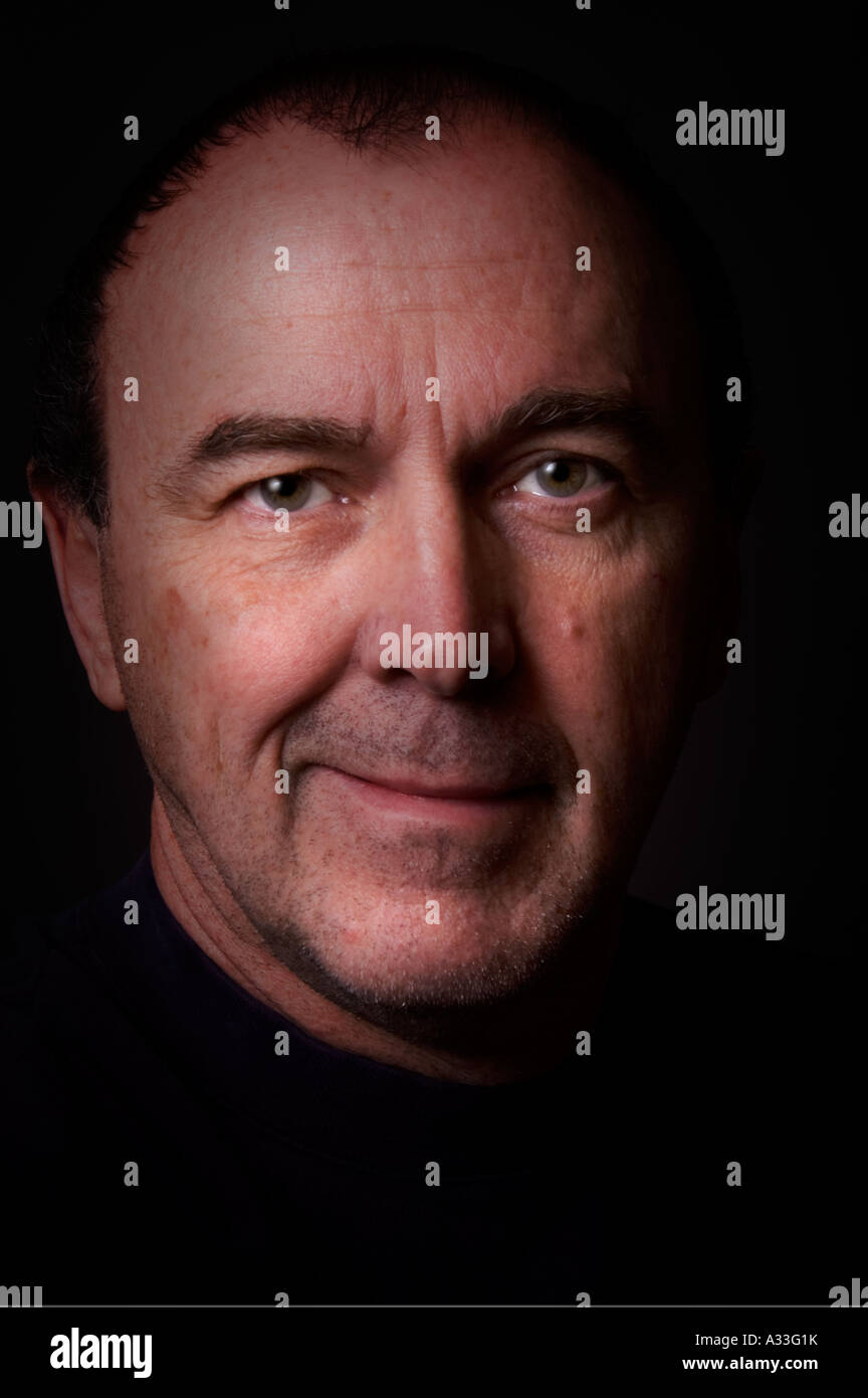 Mysterious grin hi-res stock photography and images - Alamy