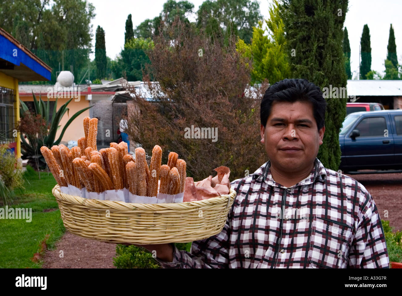 Man selling Churro in Mexico Stock Photo - Alamy