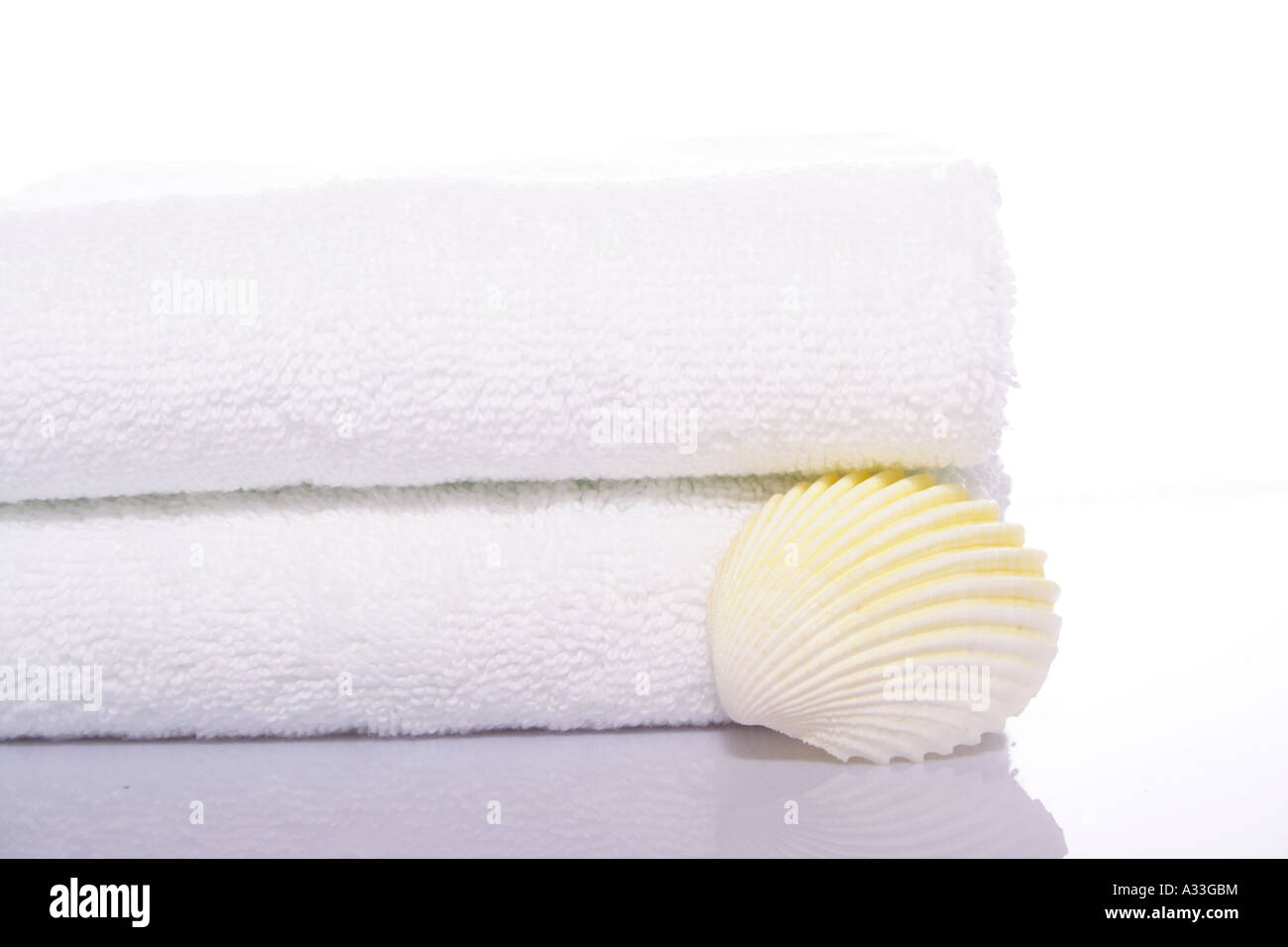 Towel and Shell Stock Photo - Alamy