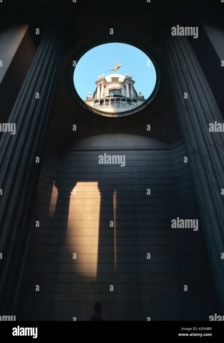 Bank of England, London, UK with golden statue of Ariel spirit of the ...