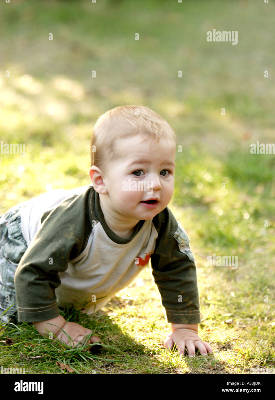Young boy crawling on ground hi-res stock photography and images - Alamy