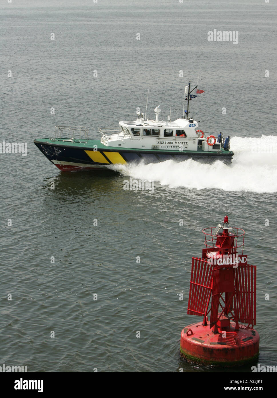 harbour master speed boat on the solent estuary southampton passing a ...