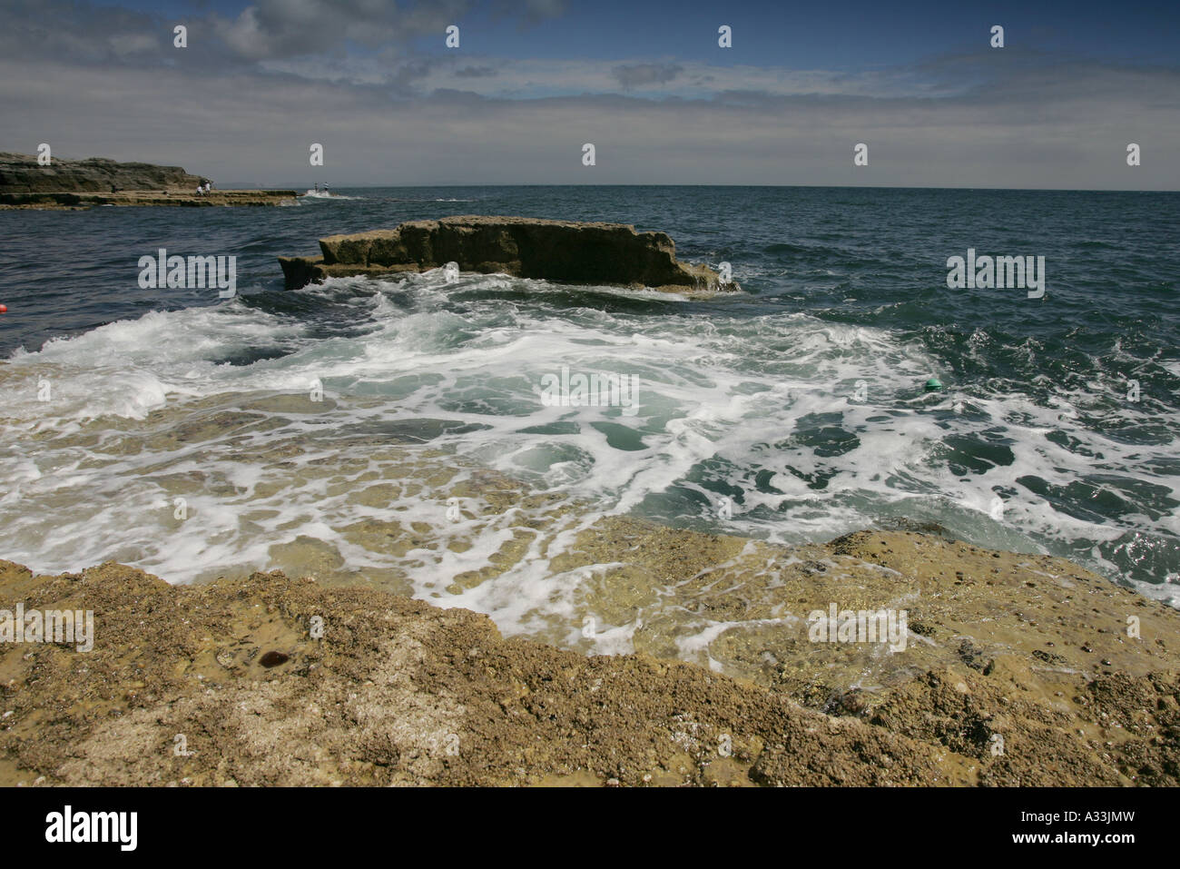 waves wash over portland bill ledges Stock Photo - Alamy