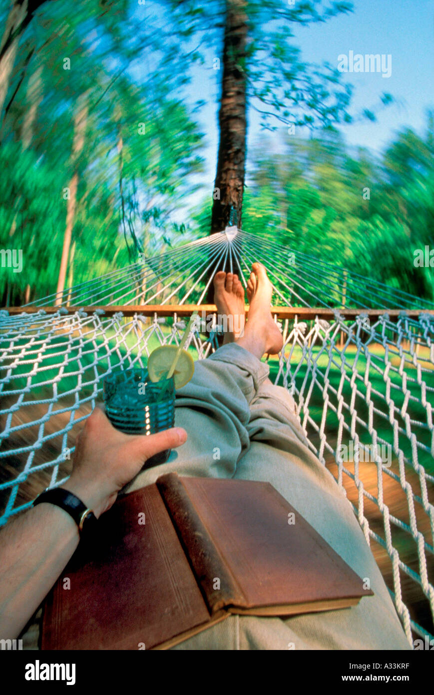 Relaxing on hammock 0F1 Stock Photo - Alamy