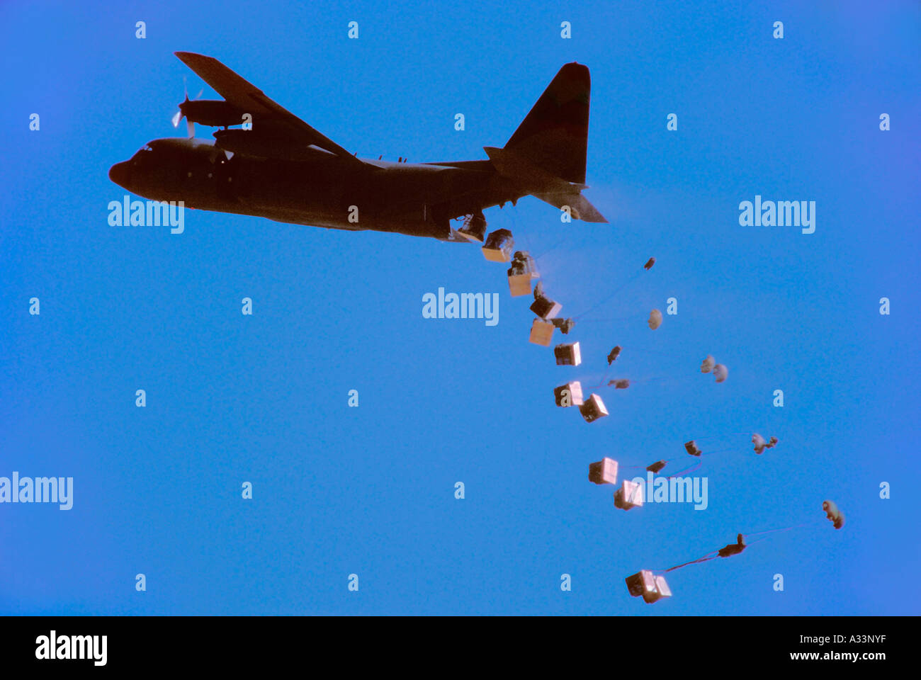 C130 Hercules drops supplies 5FE Stock Photo - Alamy