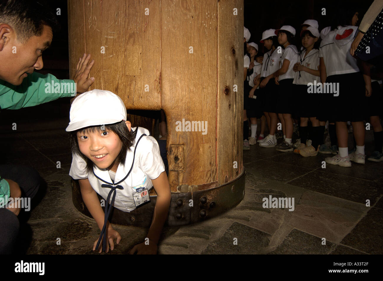 child squeezing into Nirvana those able to squeeze through hole will ...