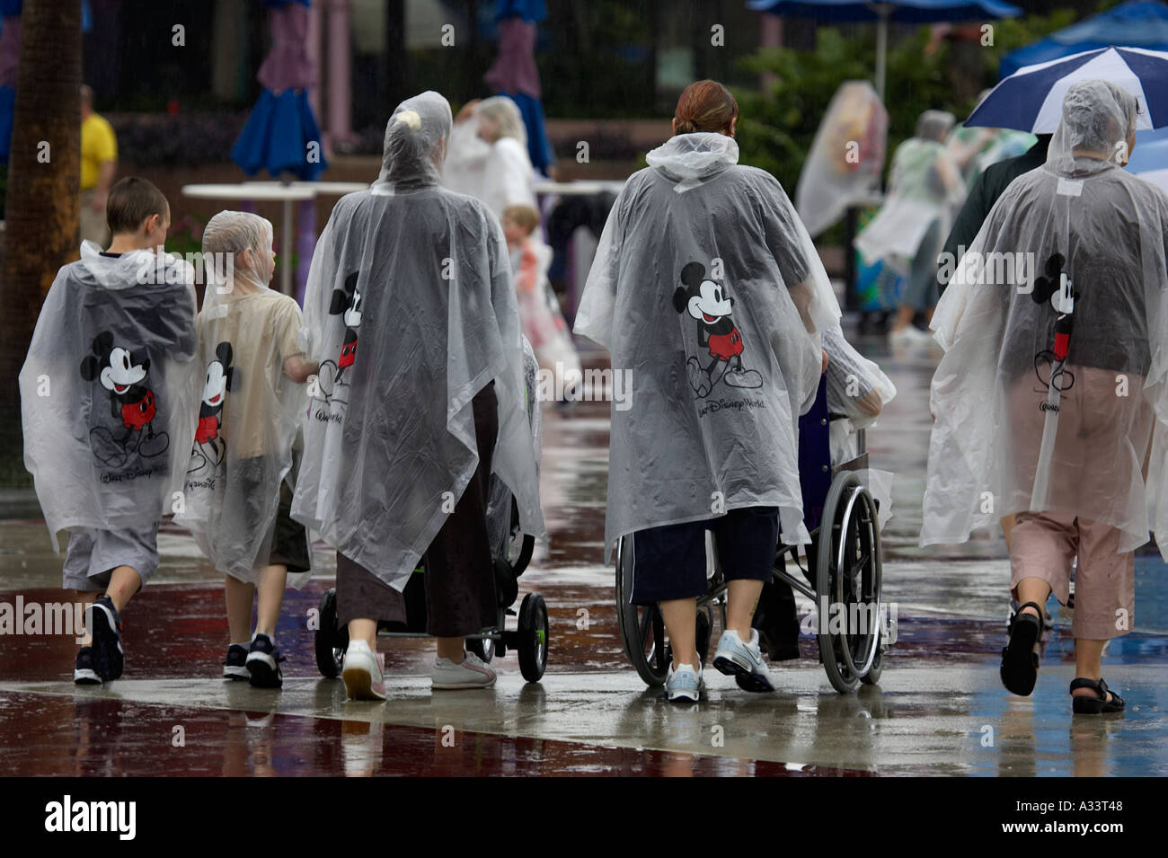 People in rain at epcot theme park orlando florida usa Stock Photo - Alamy