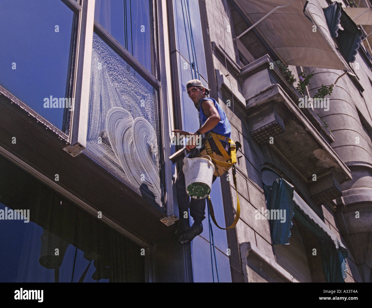 window cleaner working outside on a building of Buenos Aires Argentina ...