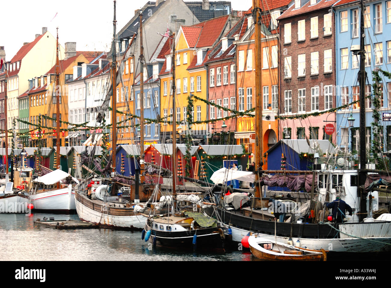 Colourful houses and wooden sailing ships and boats Nyhavn Copenhagen ...