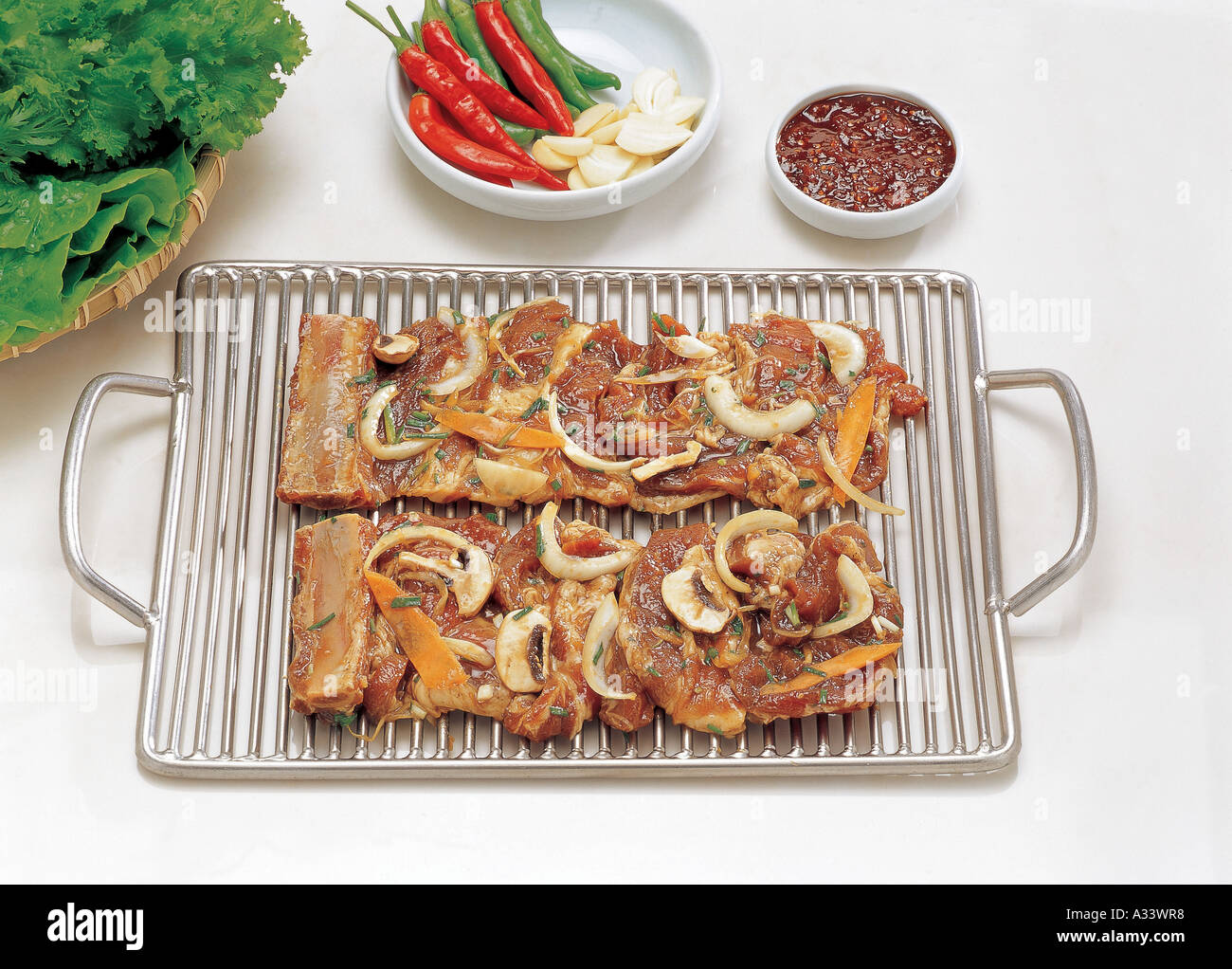 A grill filled with the Korean Bar be que Stock Photo - Alamy