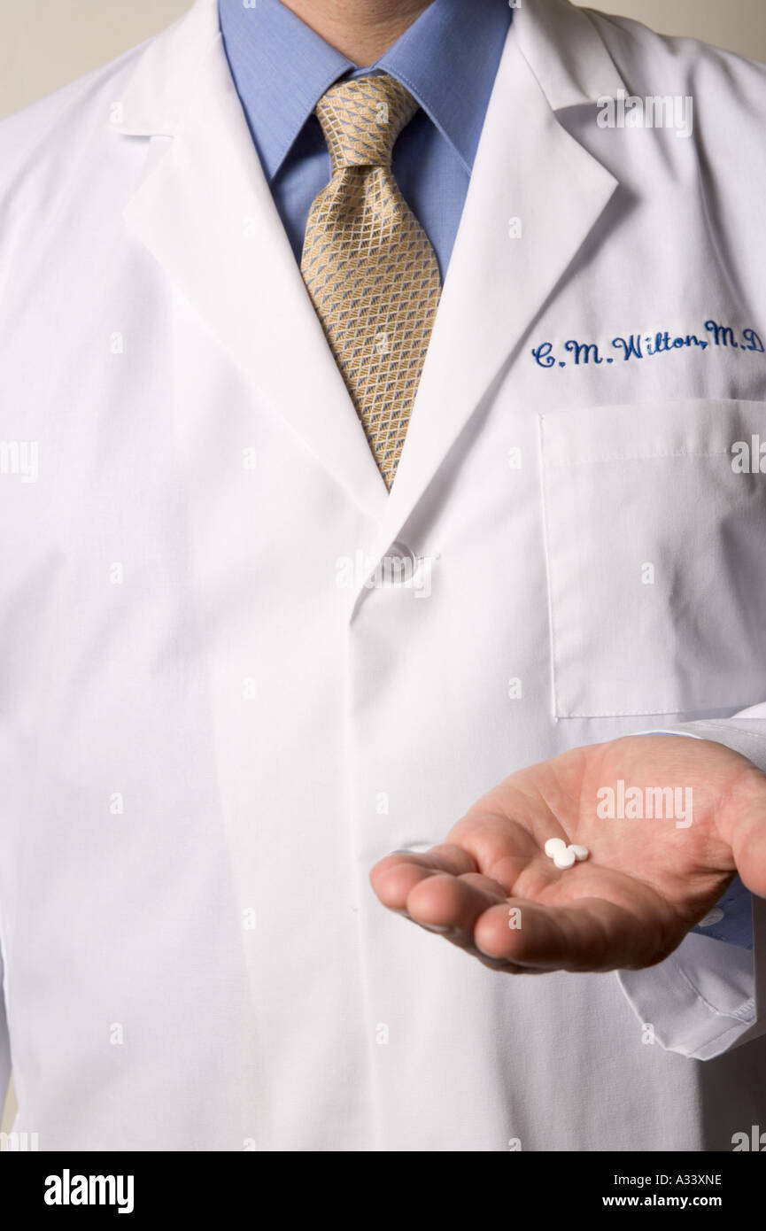 Doctor holding drugs in hand Stock Photo - Alamy