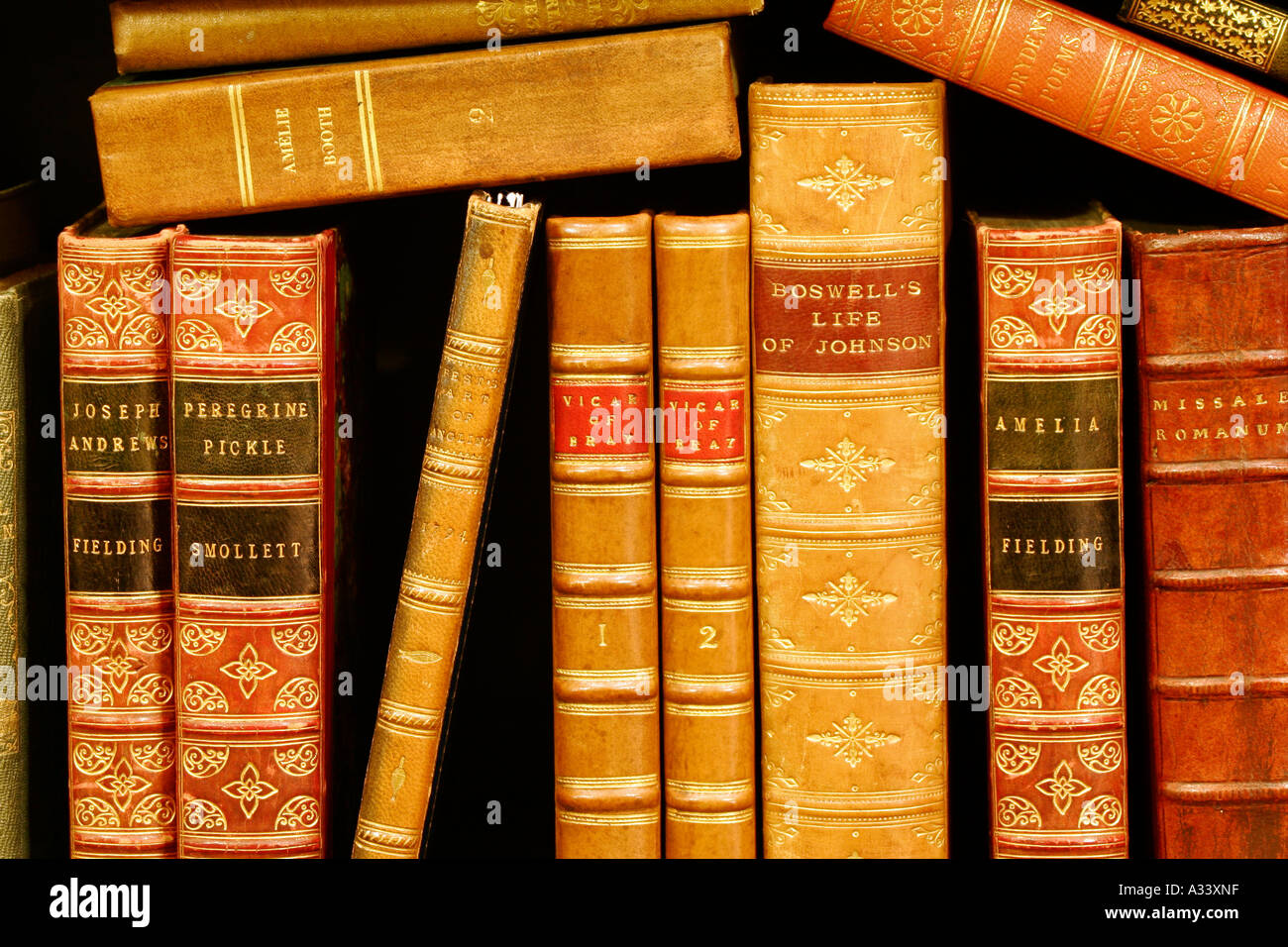 old books on a bookshelf Stock Photo - Alamy