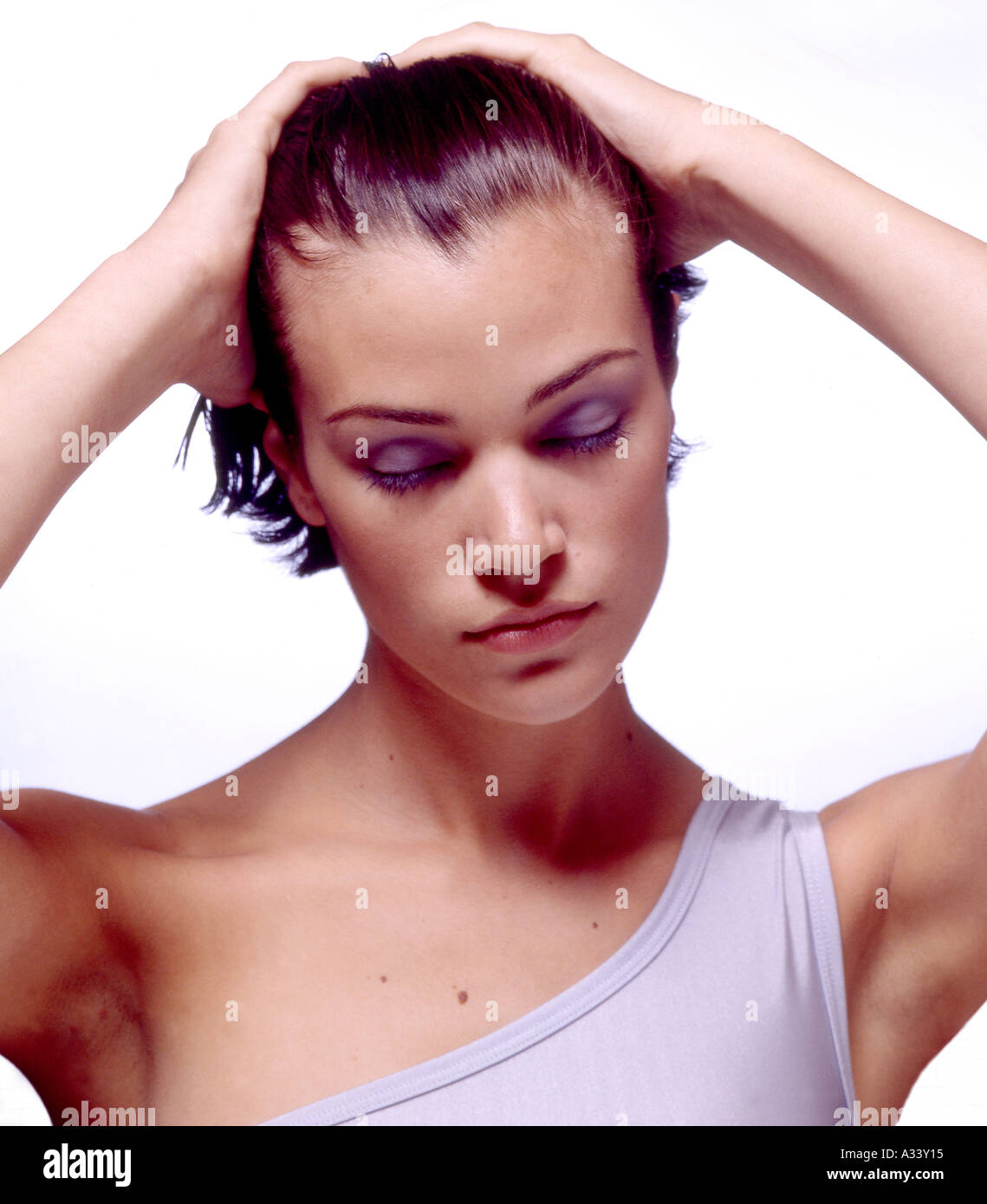 Girl Pulling her hair back Stock Photo - Alamy