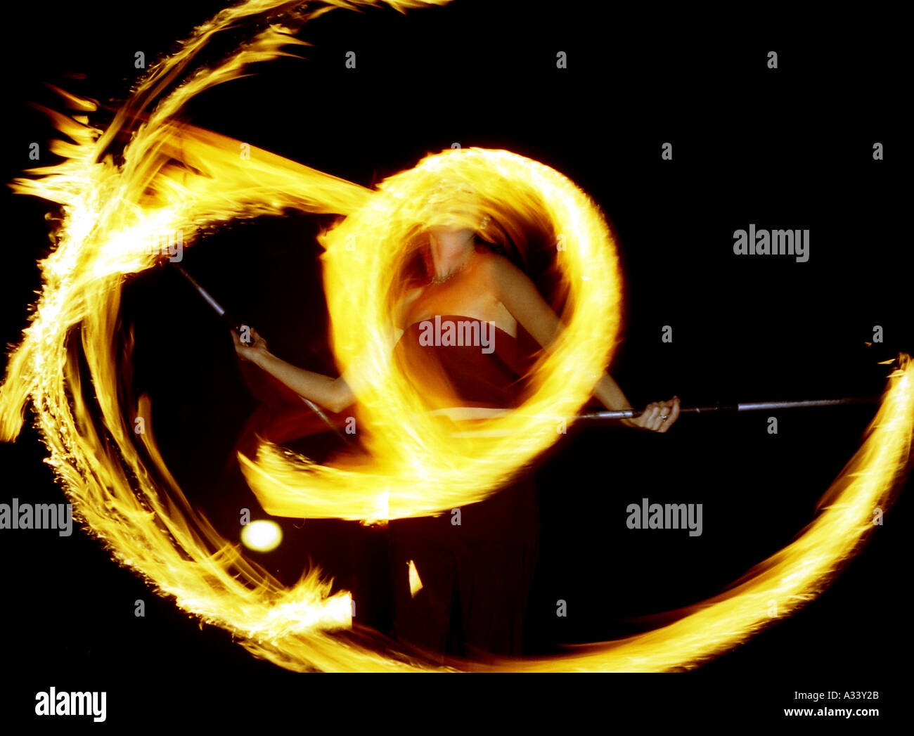 Fire Dancer Playing and twirling with fire Stock Photo - Alamy
