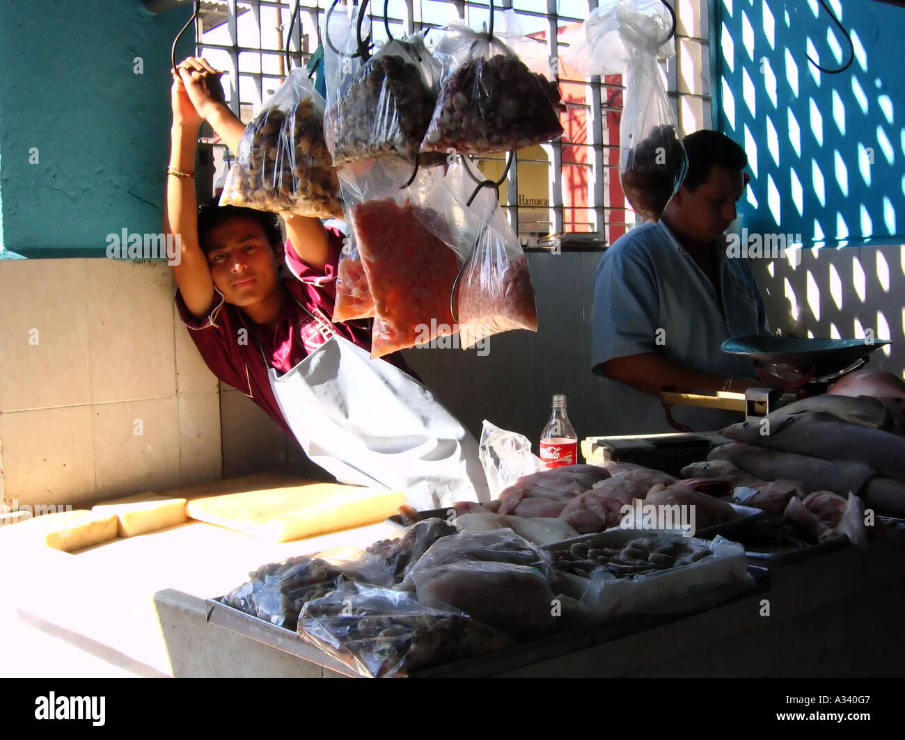 young man on fish stall, Merida, Yucatan, Mexico Stock Photo - Alamy