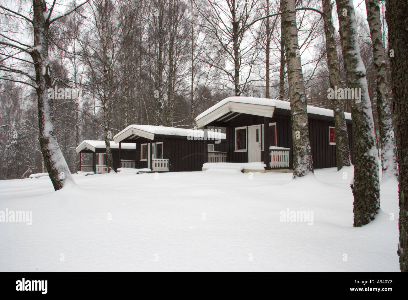 Norway, Oslo, Oslo City. Snow covered wooden camping huts / cabins in ...