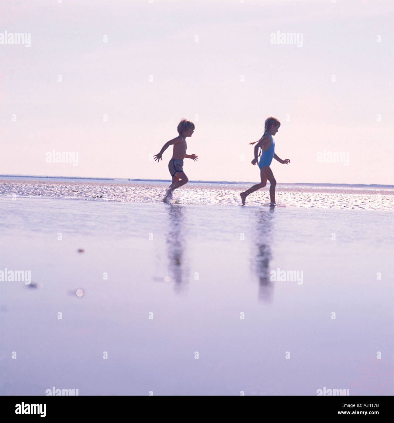 Running girls silhouettes hi-res stock photography and images - Alamy