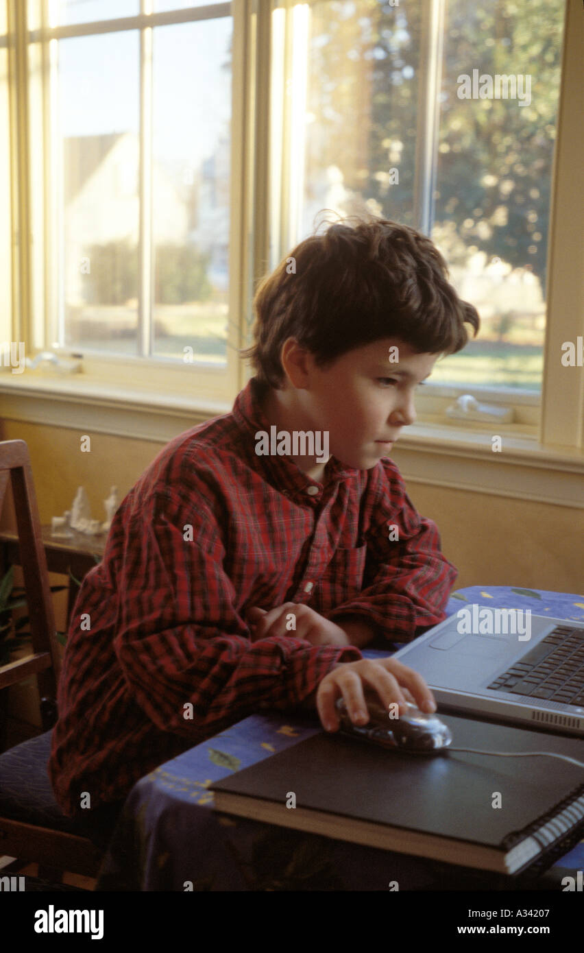 Boy with a computer Stock Photo - Alamy